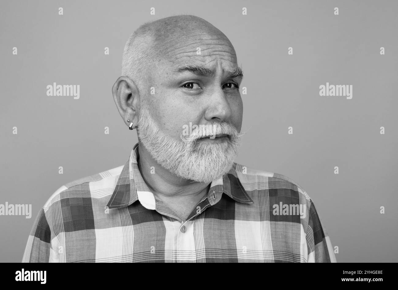 Closeup emotional portrait of an old mature senior man with grey beard ...