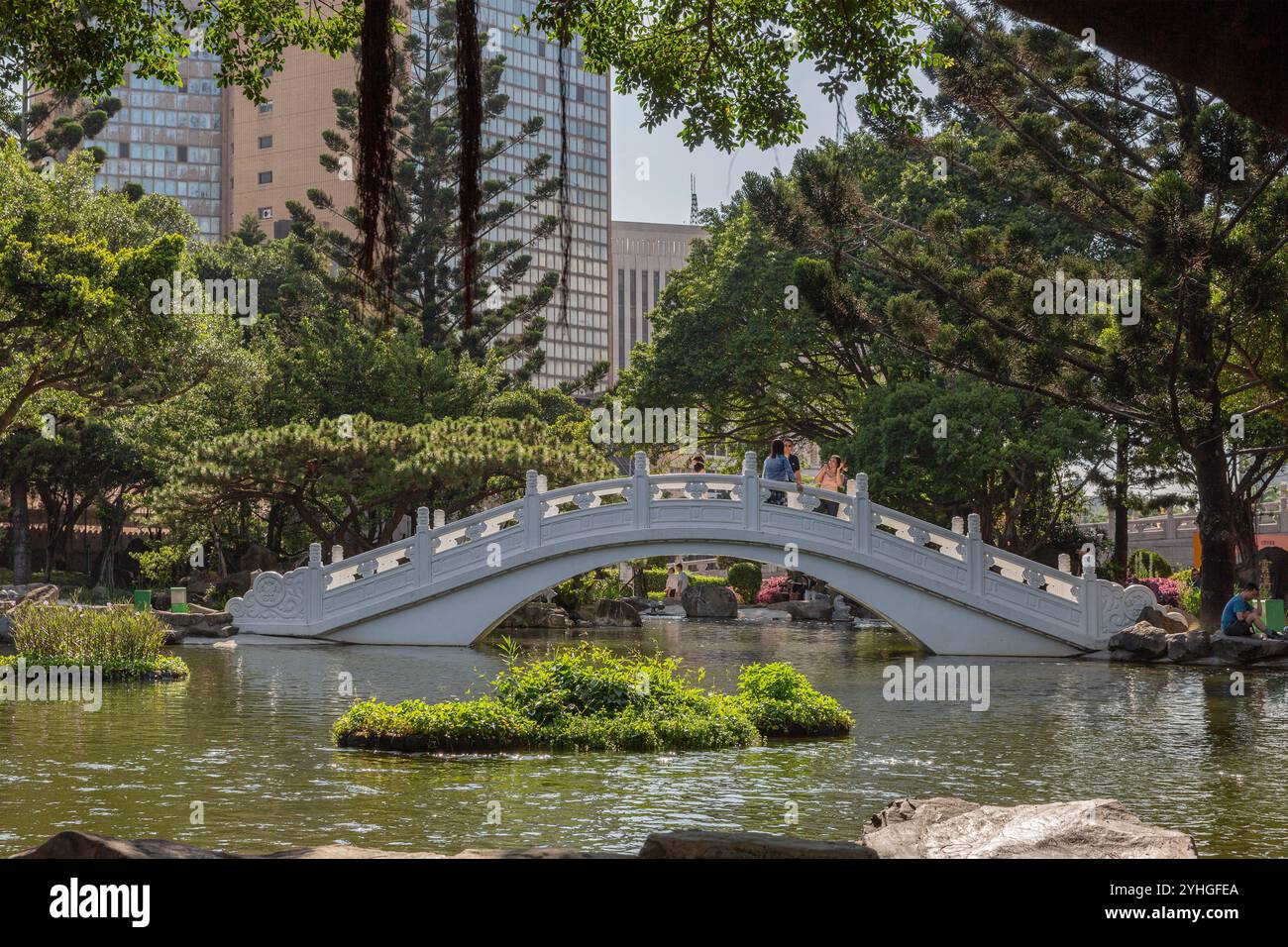 a white Asian style bridge in a lake and park in Taipei Stock Photo - Alamy