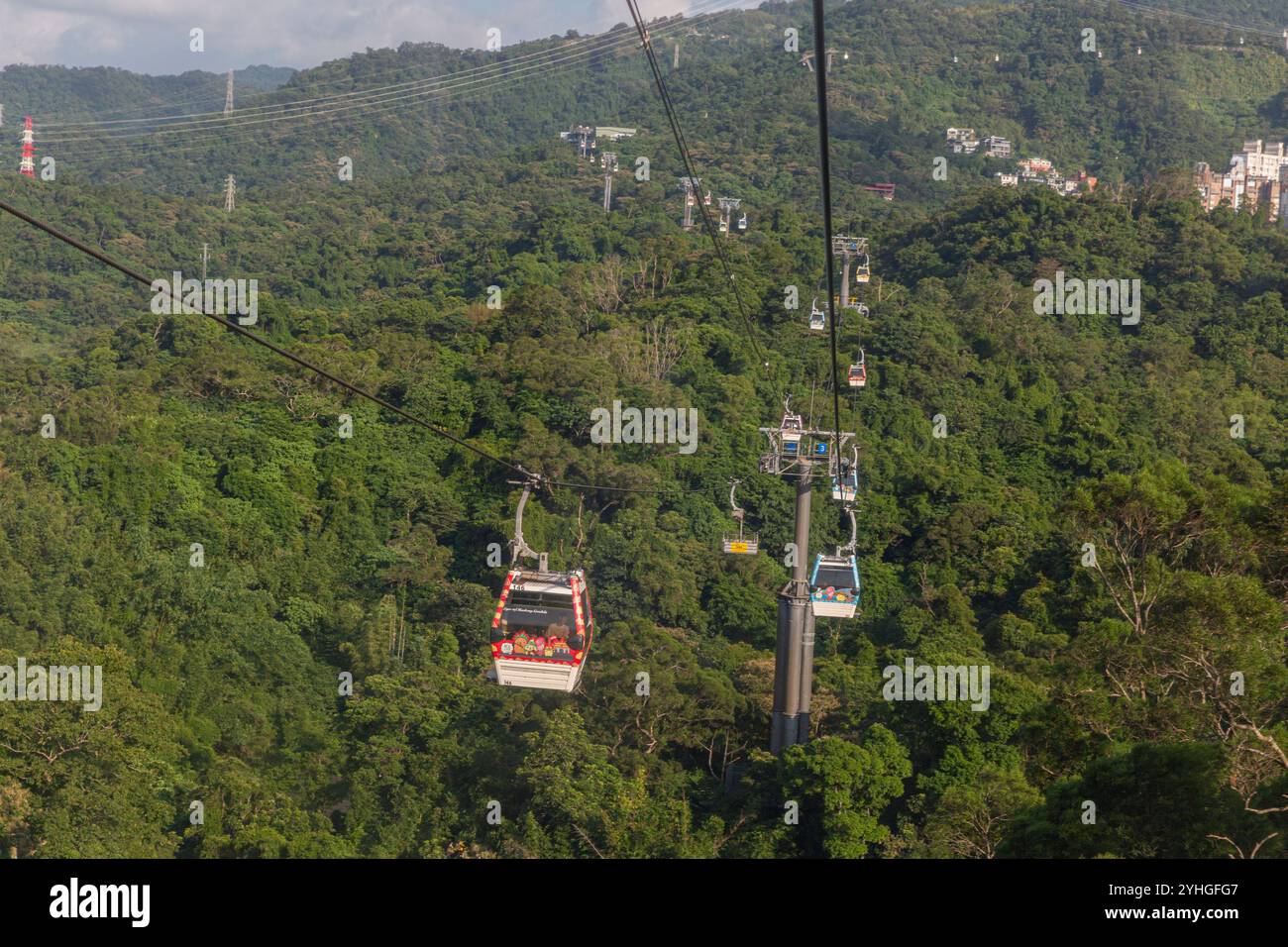 A view of the Taipei cable cars travelling up the mountain to the ...