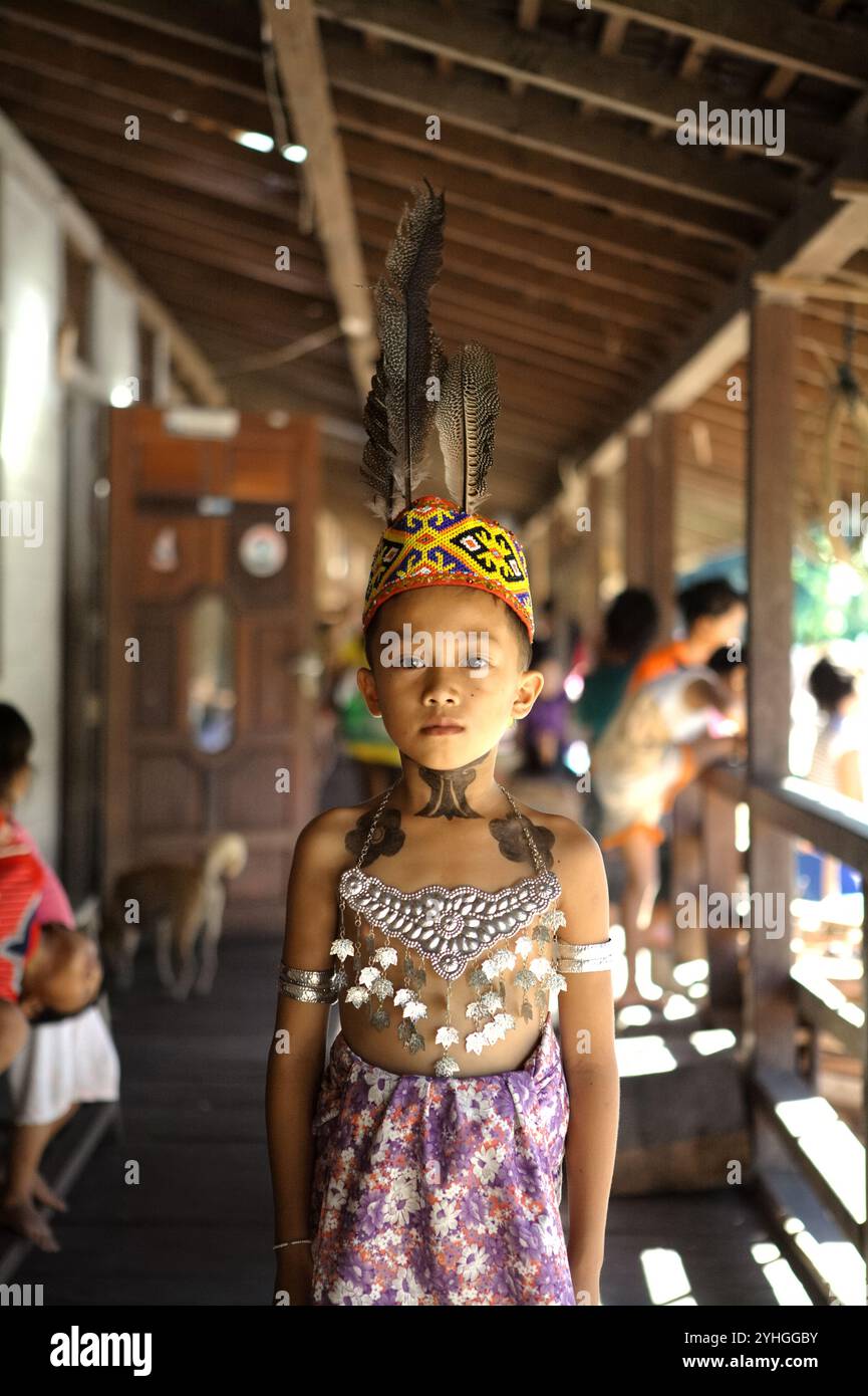 Portrait of a child in traditional attire, with temporary tattoos made ...