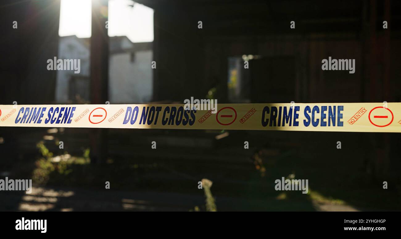 Crime scene, police tape and caution in building for investigation with ...
