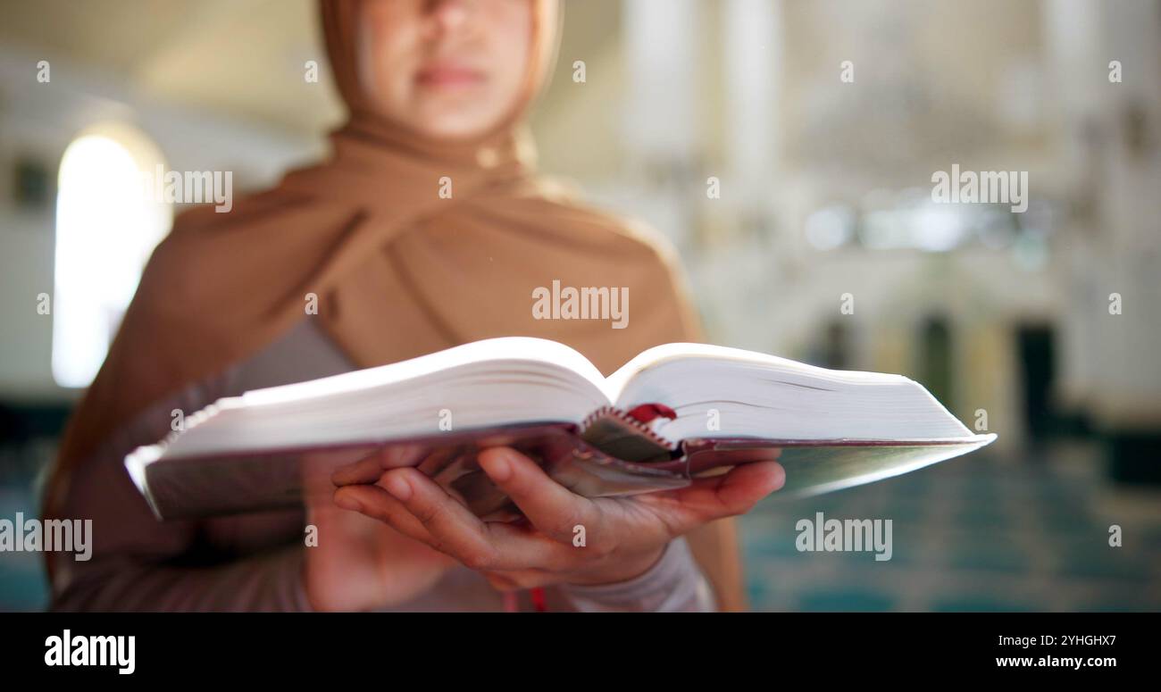 Muslim woman, hands and reading with quran at mosque for recitation ...