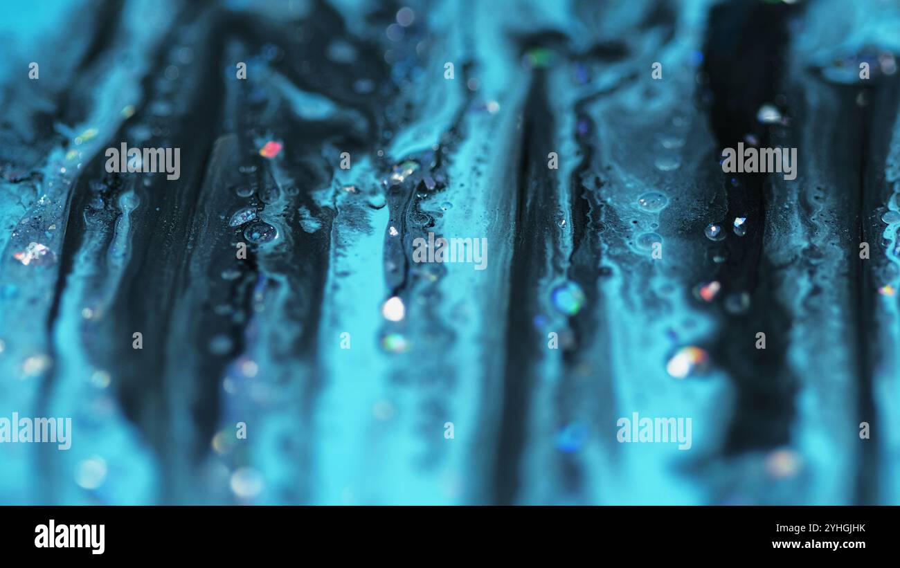 Shiny ink spill. Acrylic paint. Defocused blue black color holographic ...