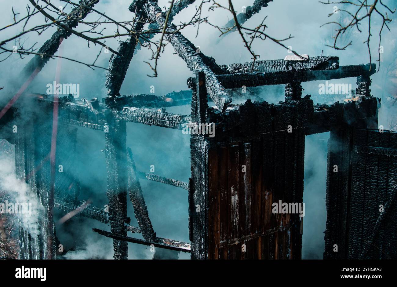 Aftermath of fire disaster. Smoke after great fire. Burned down to the ...