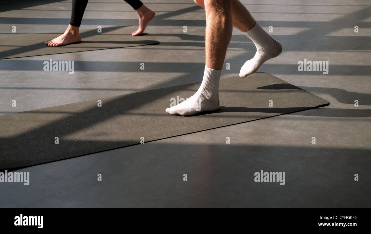 Yoga group. Aerobic workout. Unrecognizable active people stepping ...