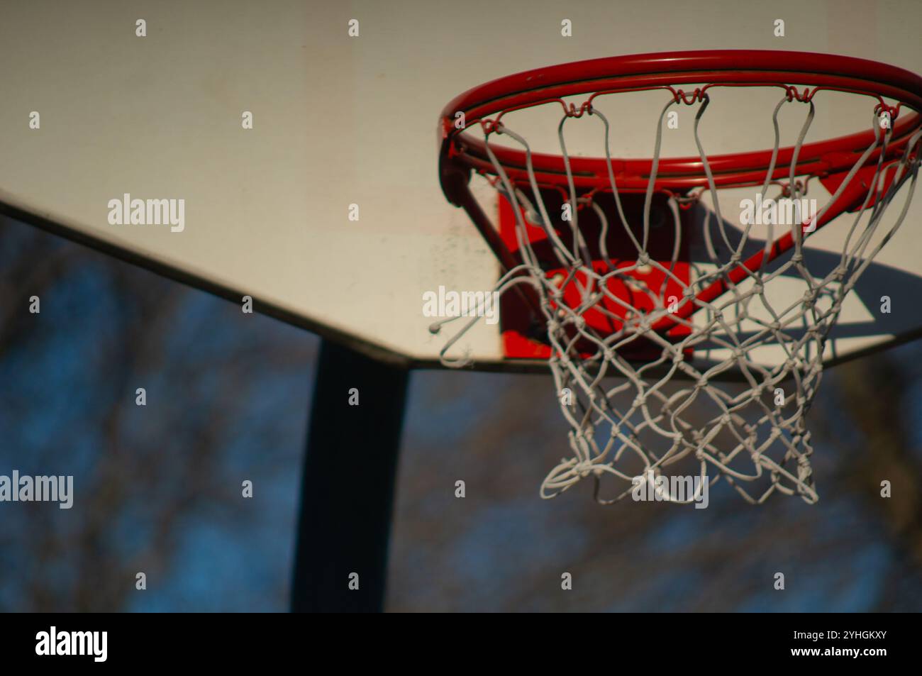 Basketball hoop with worn net Stock Photo - Alamy
