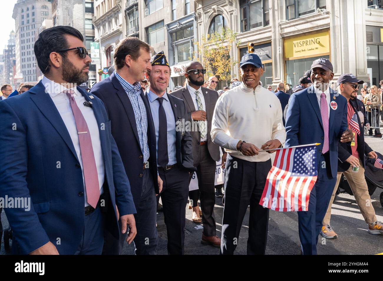 New York, USA. 11th Nov, 2024. Mayor Eric Adams (2nd from R) and James ...