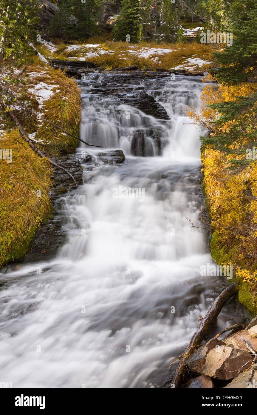 King's Creek pouring over cascading waterfalls surrounded by fall ...