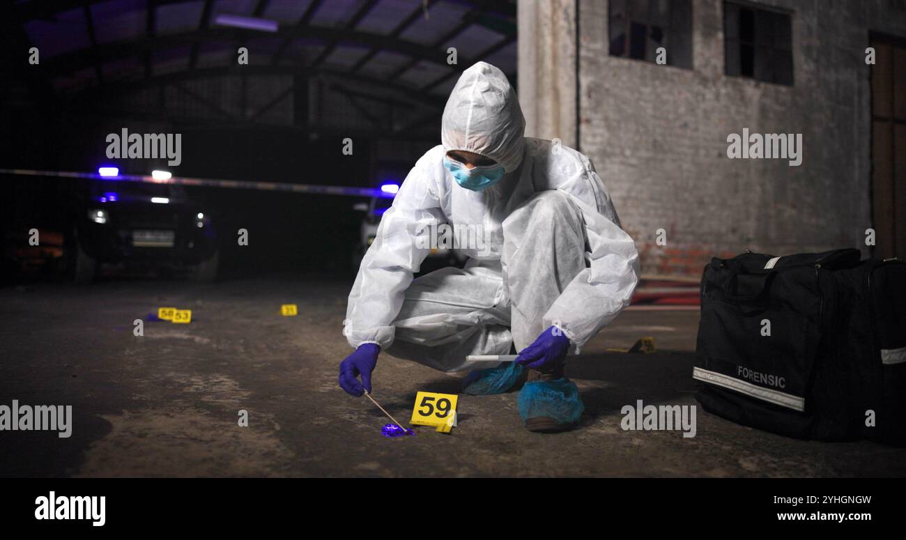 Person, swab and law investigation at crime scene, blood sample and ...
