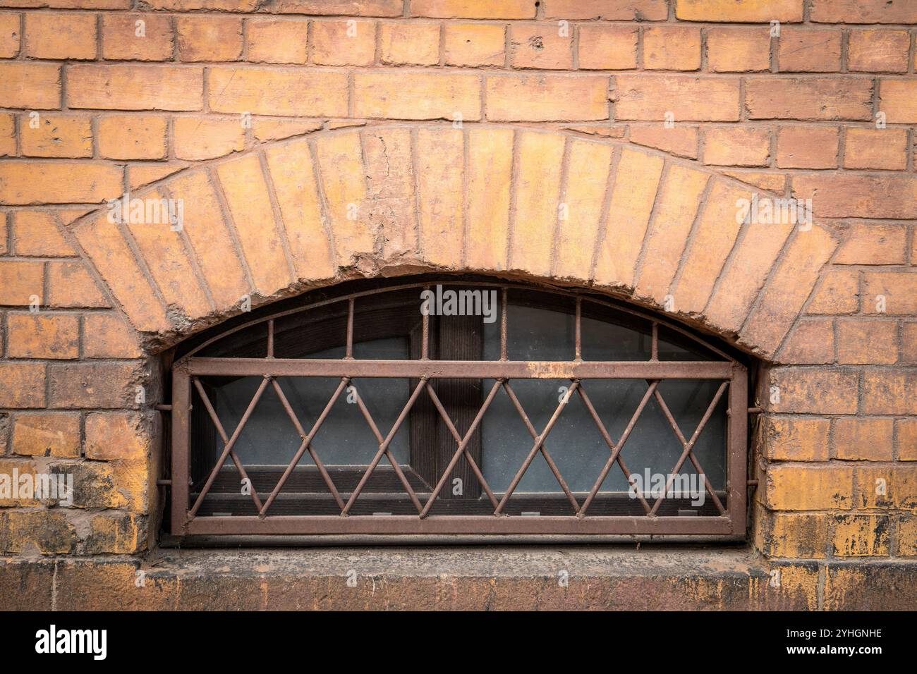 A barred window in the basement of a historic building Stock Photo - Alamy