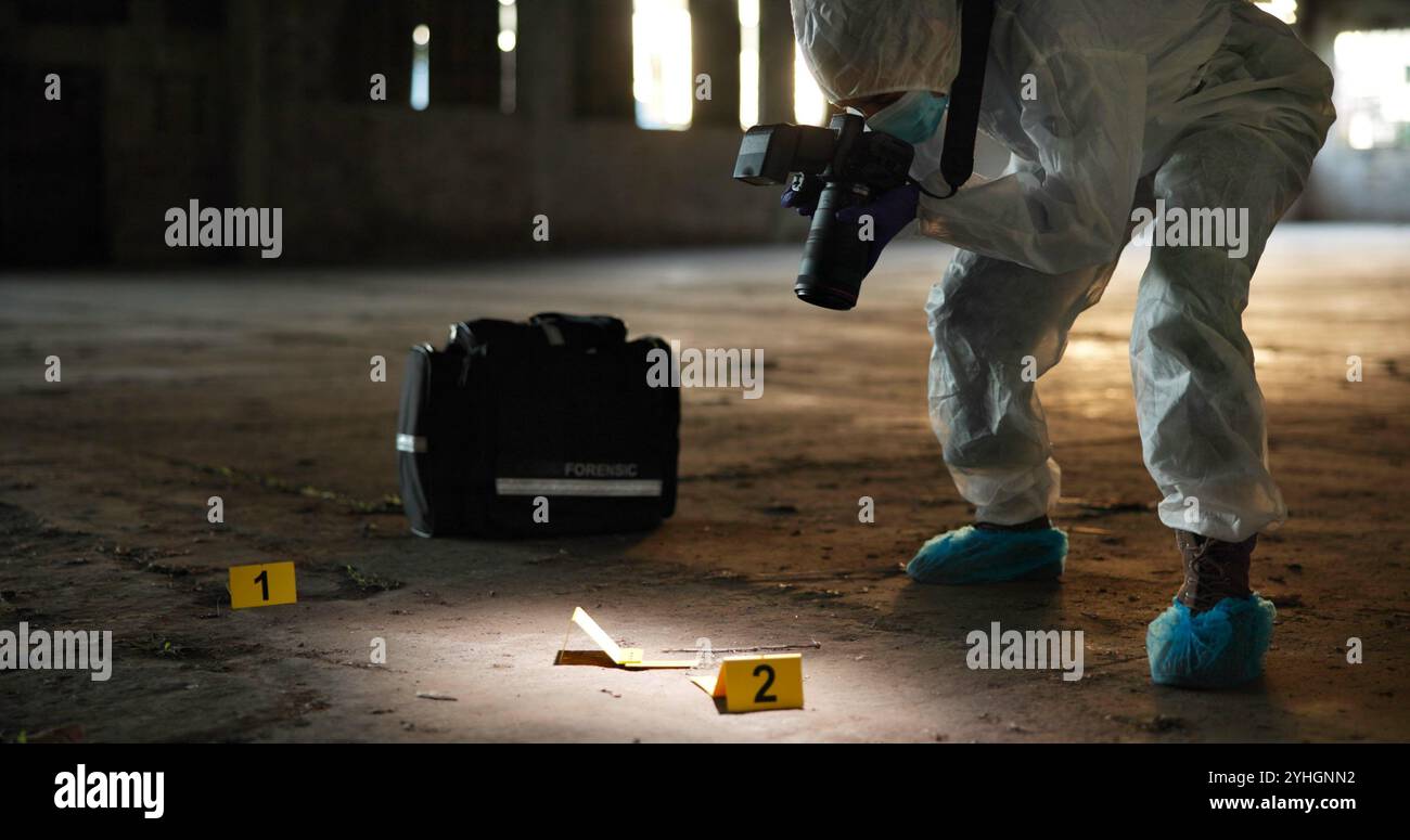 Crime, person and photography at scene for evidence, documentation and ...