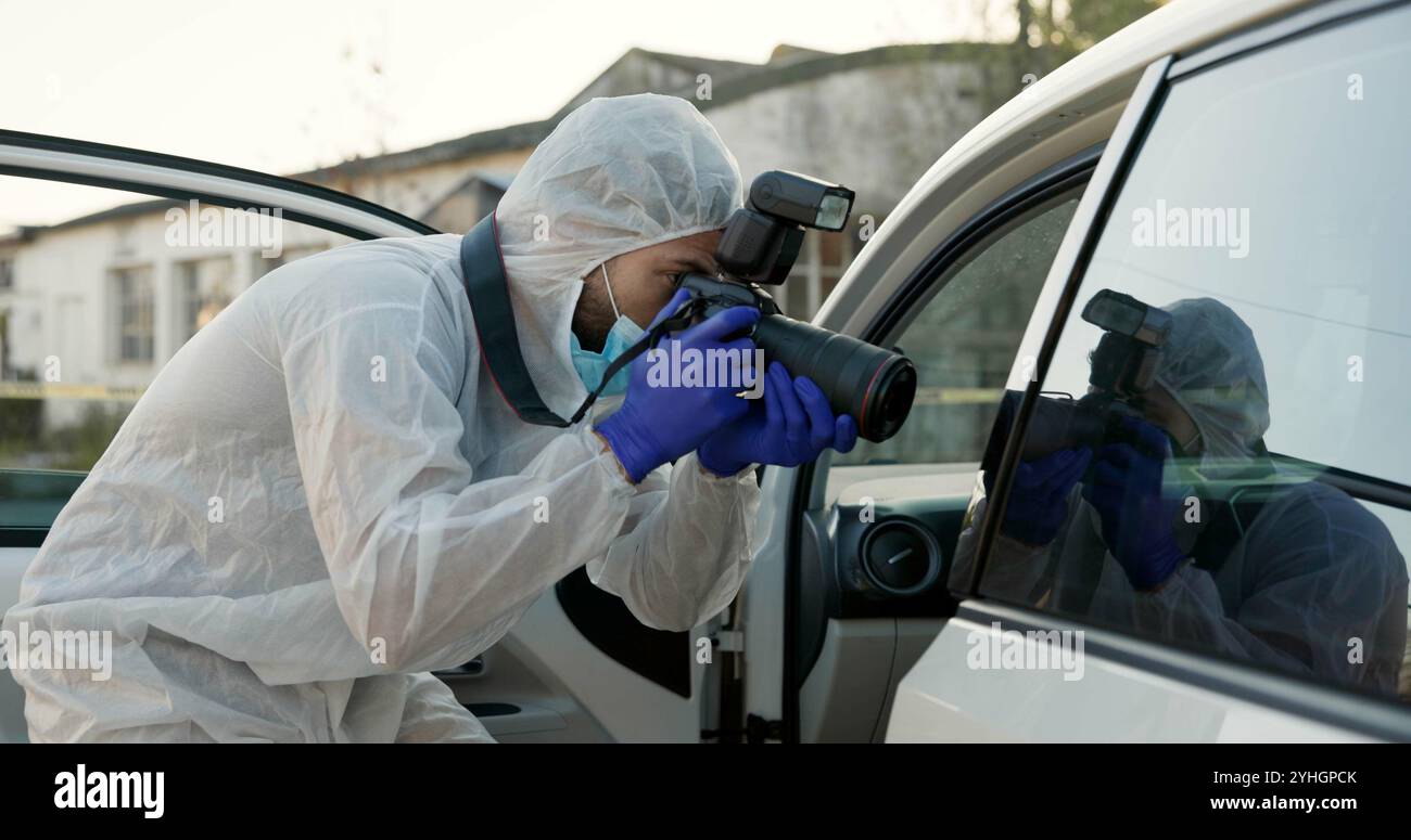 Man, forensic photographer and camera at crime scene by car for evidence, inspection and police ...