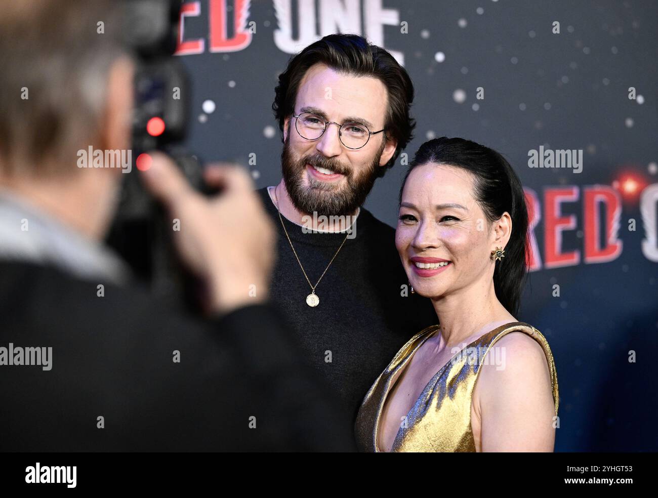 Chris Evans, left, and Lucy Liu attend the Amazon MGM Studios premiere ...