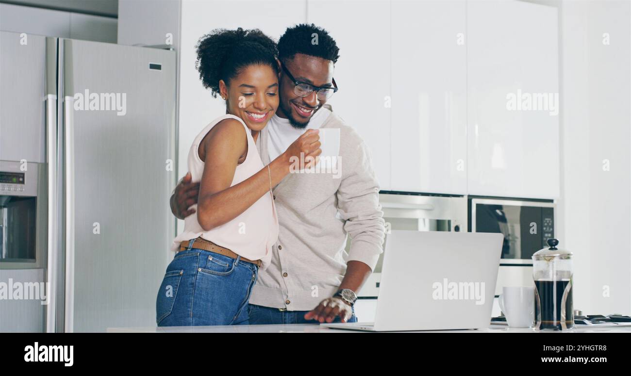 Couple, laptop and coffee in kitchen with hug for support, remote work ...