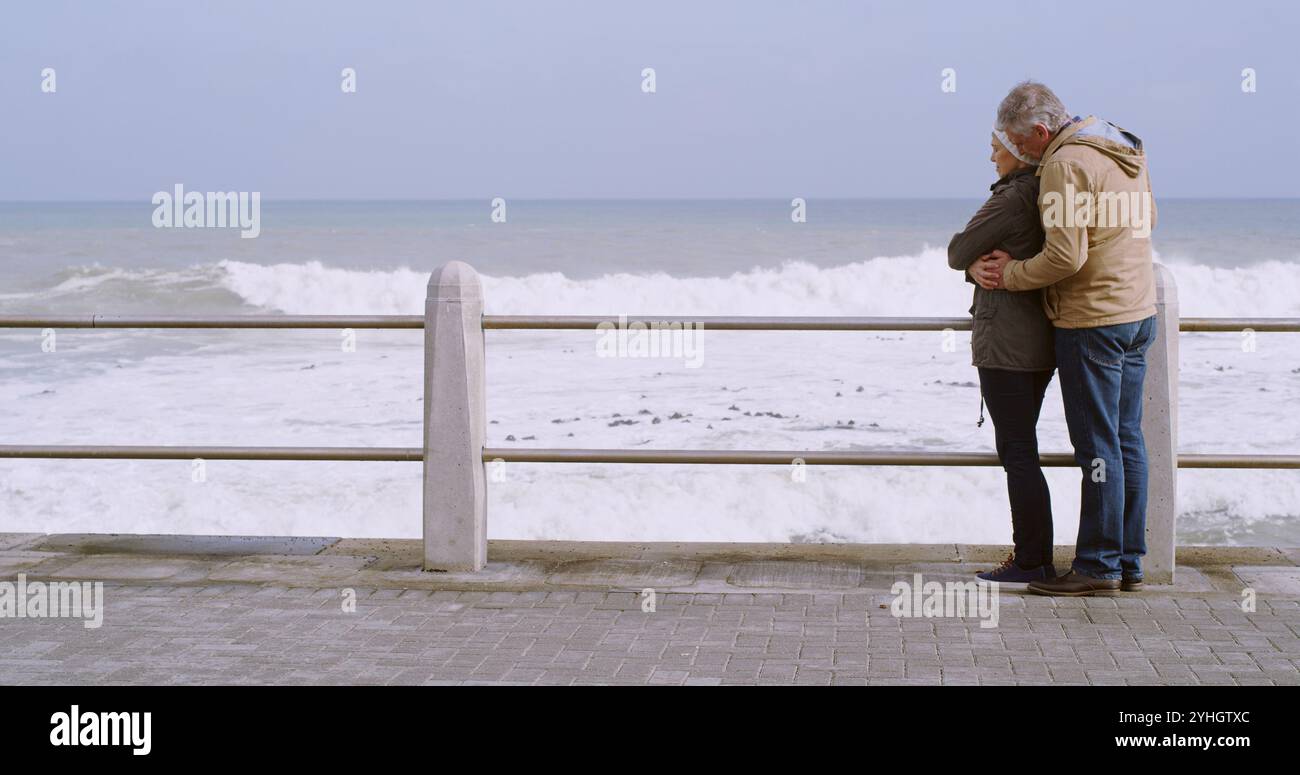Mature couple, hug and bonding together by ocean, water and beach for ...