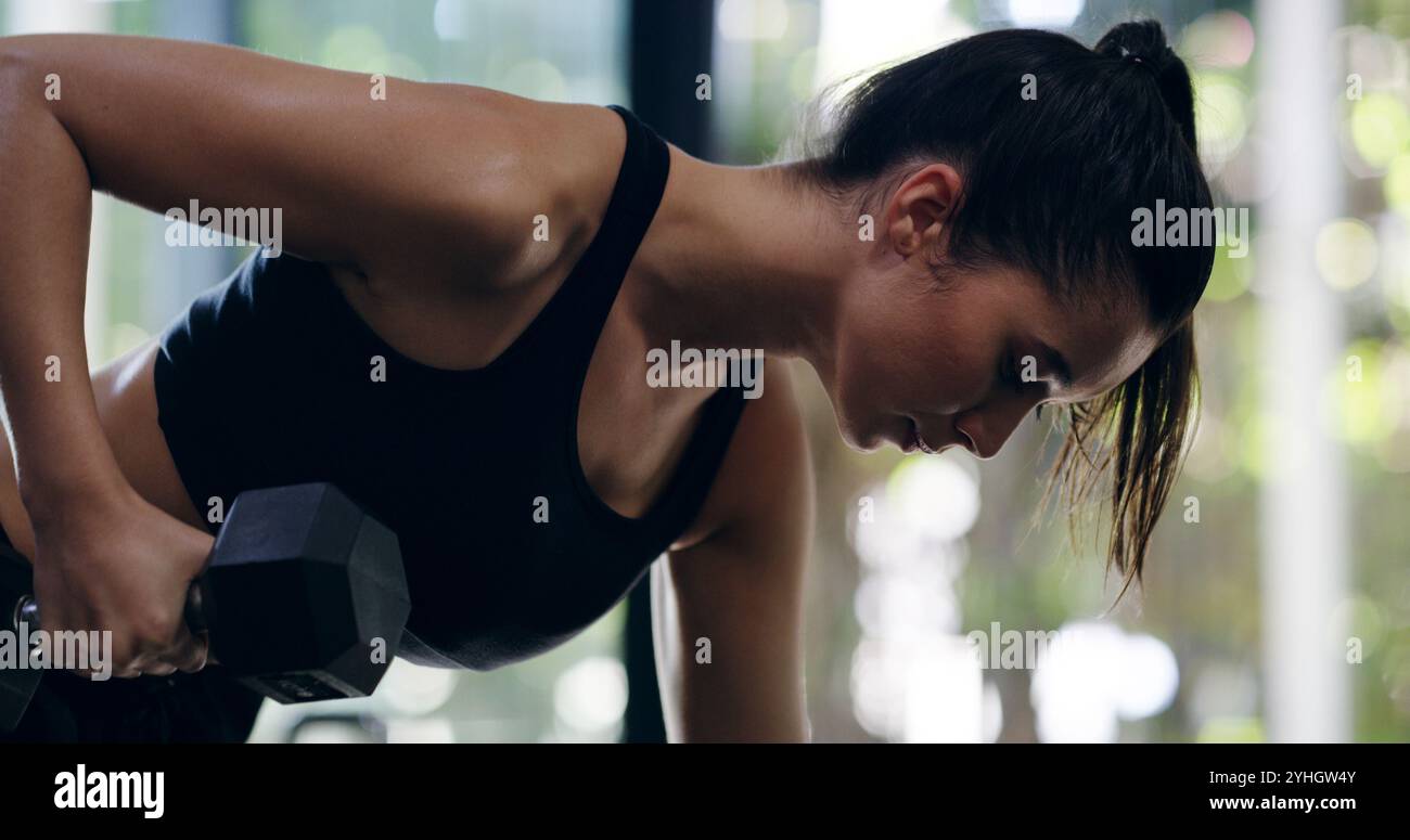 Arm, dumbbell and fitness with woman in gym for physical improvement or ...