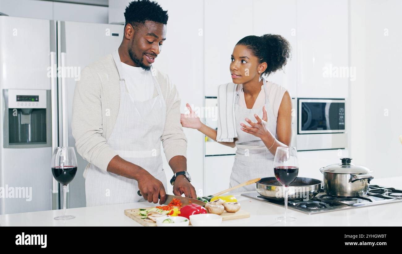 Cooking, conversation and couple in kitchen, vegetables or dinner with ...