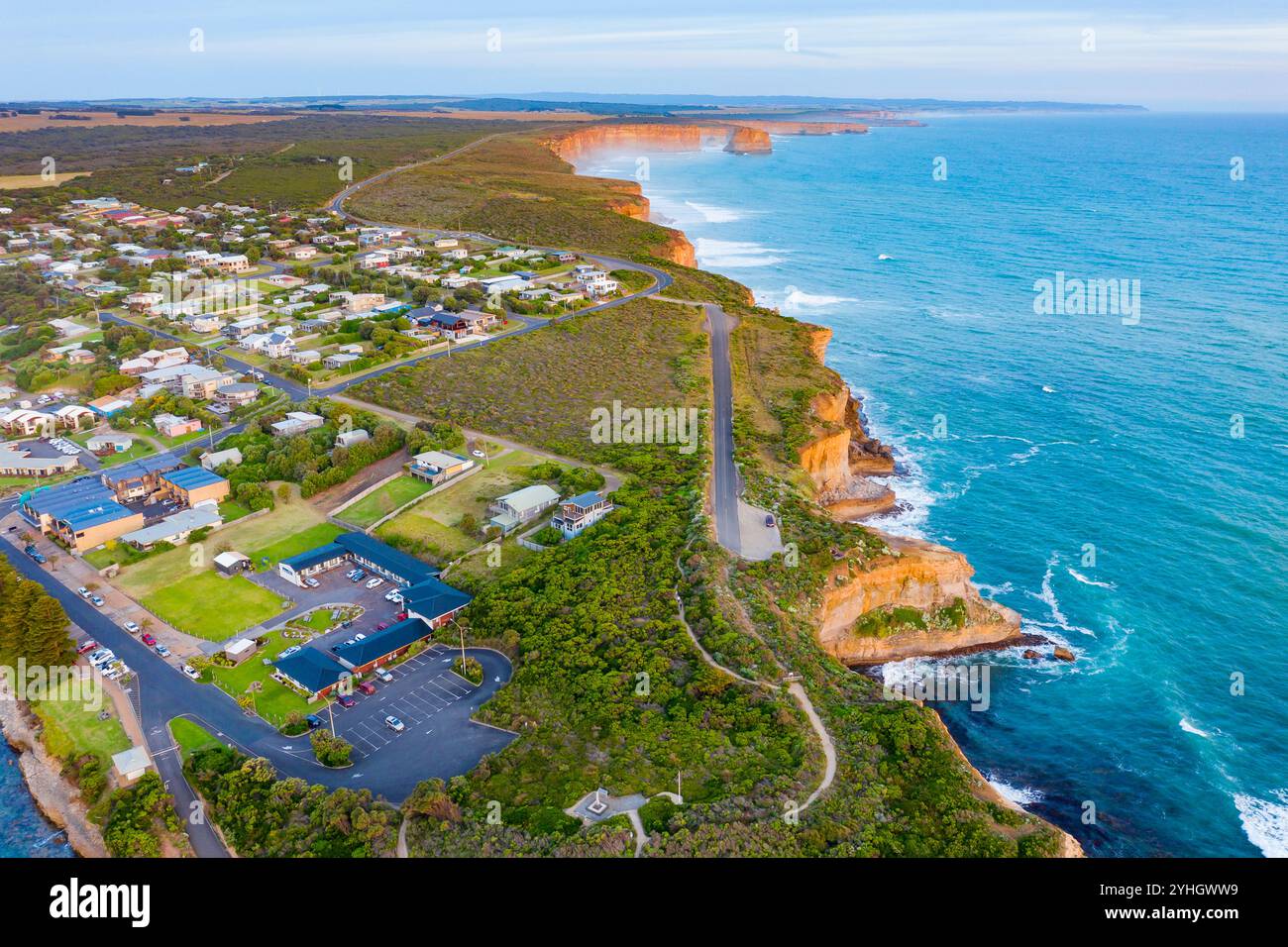 Aerial view of a coastal road and carpark lookout along a rugged ...