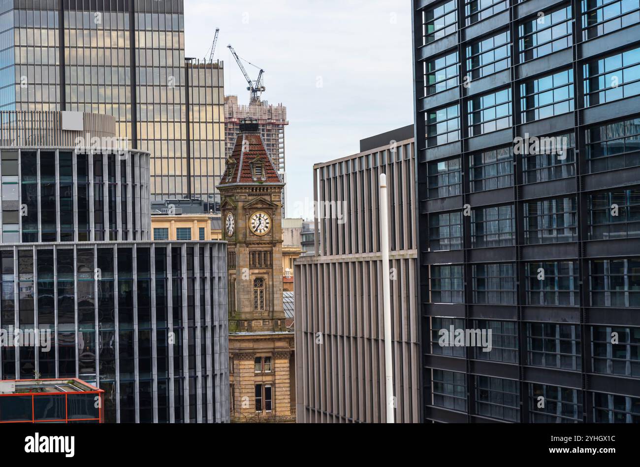 Old clock tower within large modern skyscrapers, old mixing with new ...
