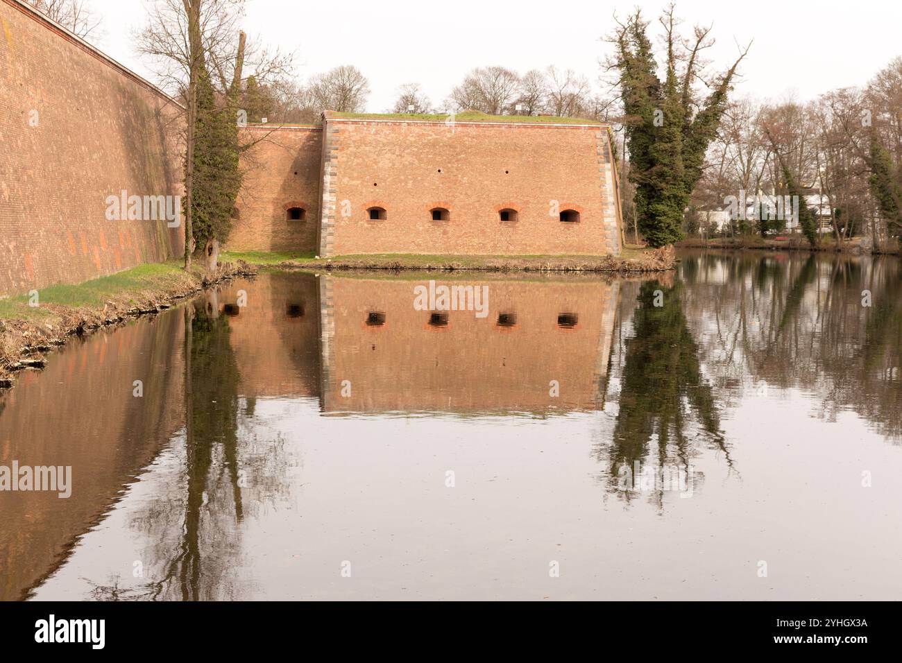 The Spandau Citadel reflected in calm water, showcasing its historic ...