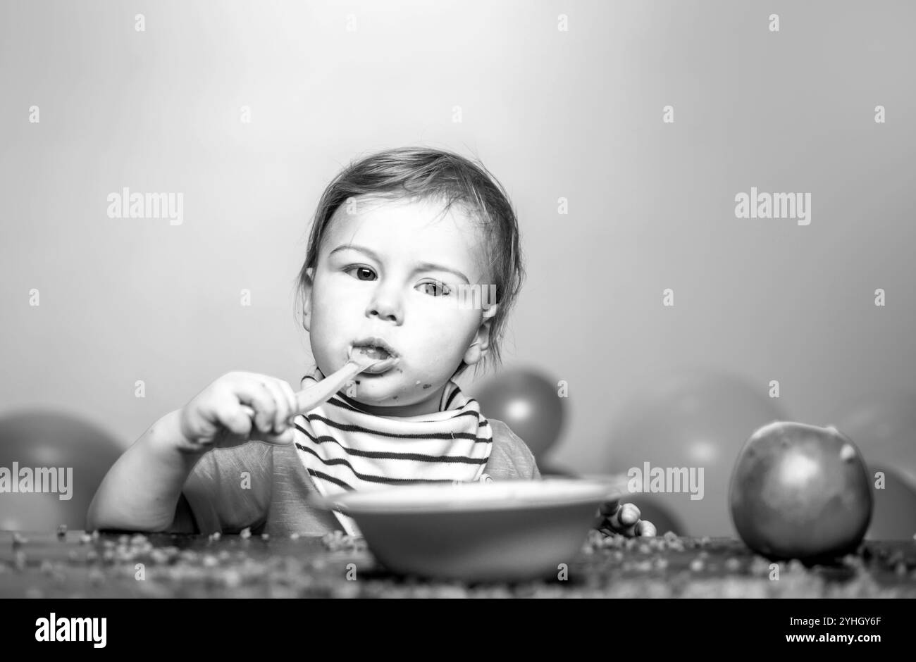 Kid eat healthy nutrition, baby food. Babies eating with spoon. Funny ...