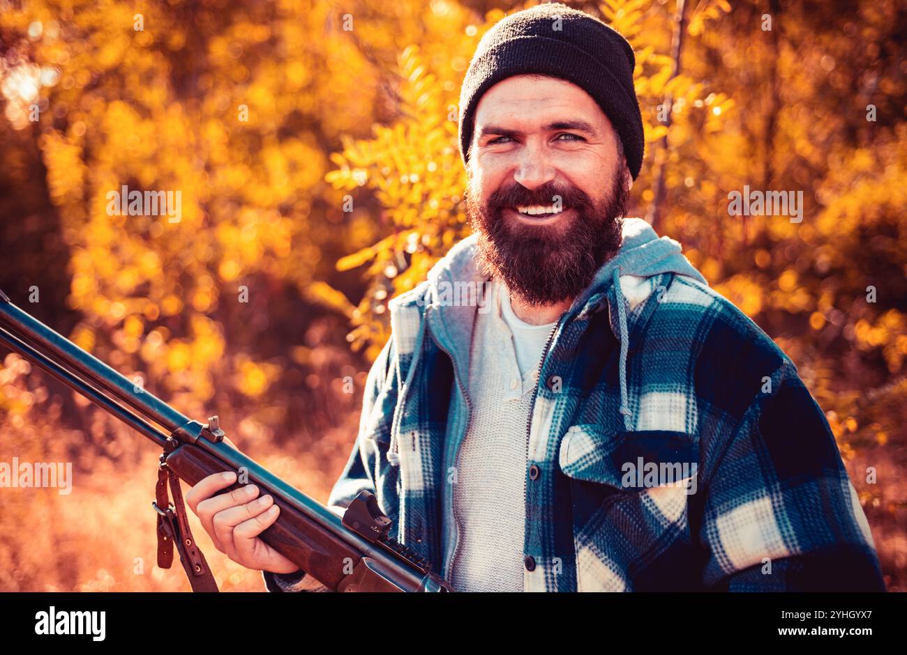 Closed and open hunting season. Hunter with shotgun gun on hunt. Close ...