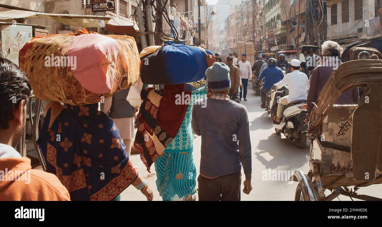 Varanasi, Uttar Pradesh, India. Indian women carry things on their ...