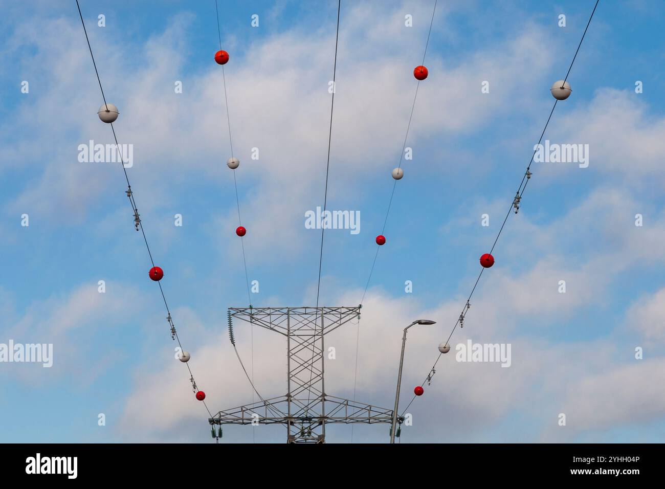 High-voltage power line with wires on which multi-colored balls are ...