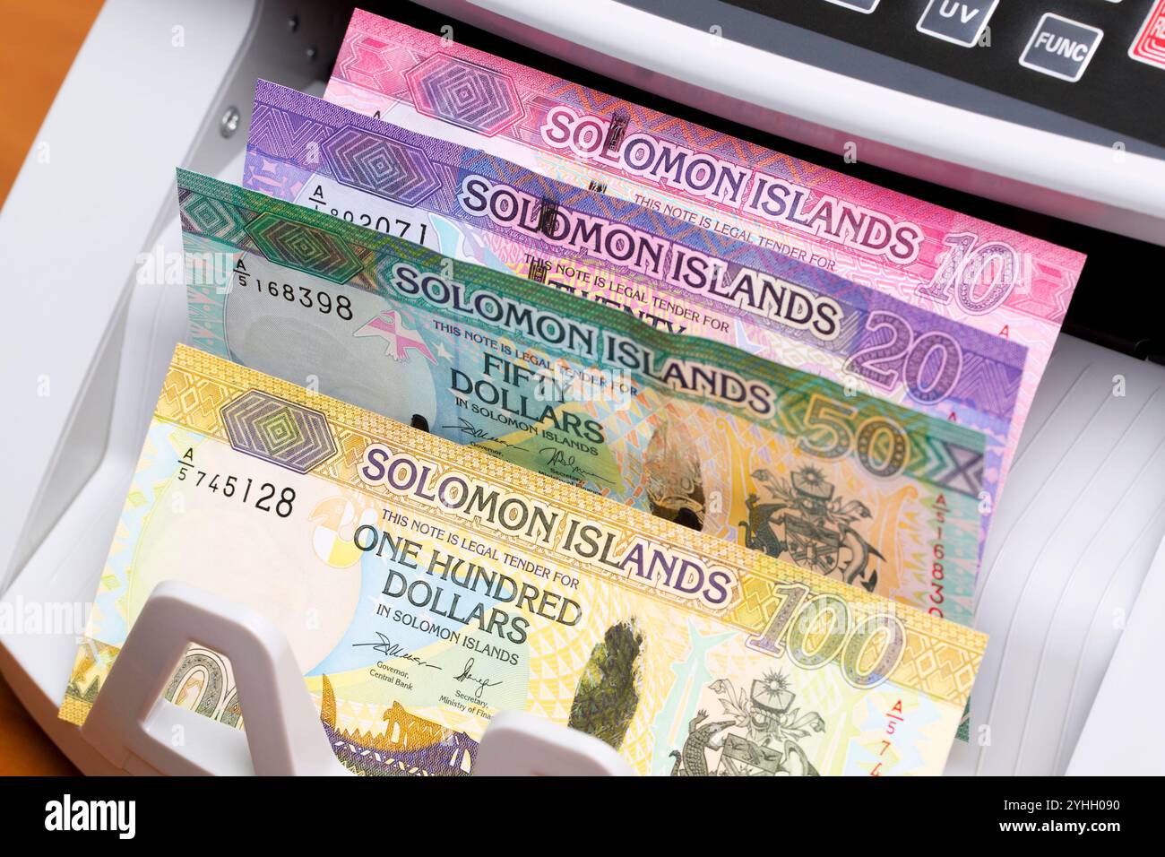 Solomon islands money - dollar - in the counting machine Stock Photo ...