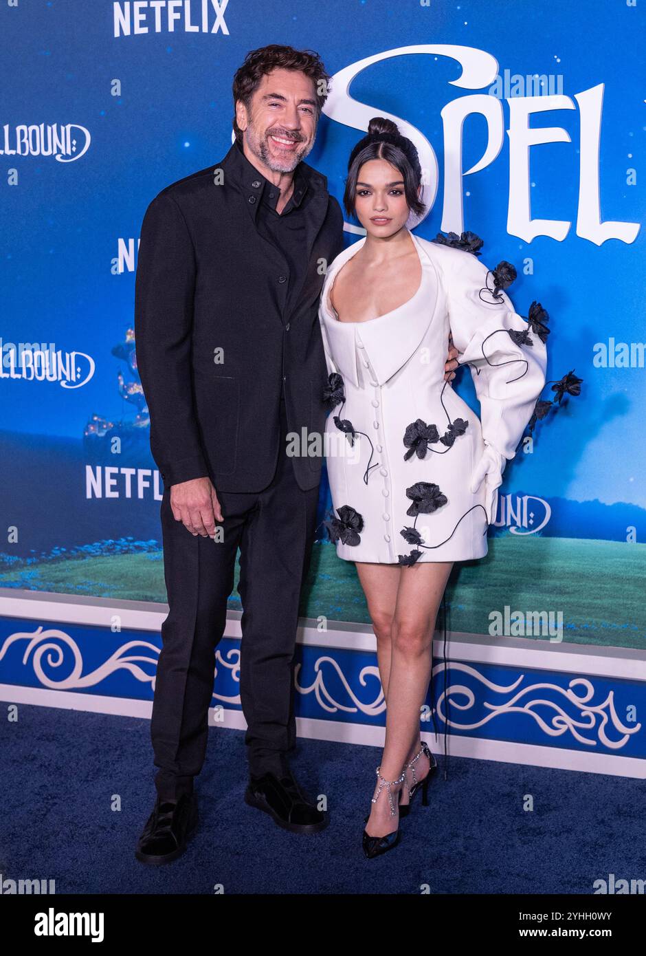 Javier Bardem wearing suit by Zegna and Rachel Zegler wearing dress by ...