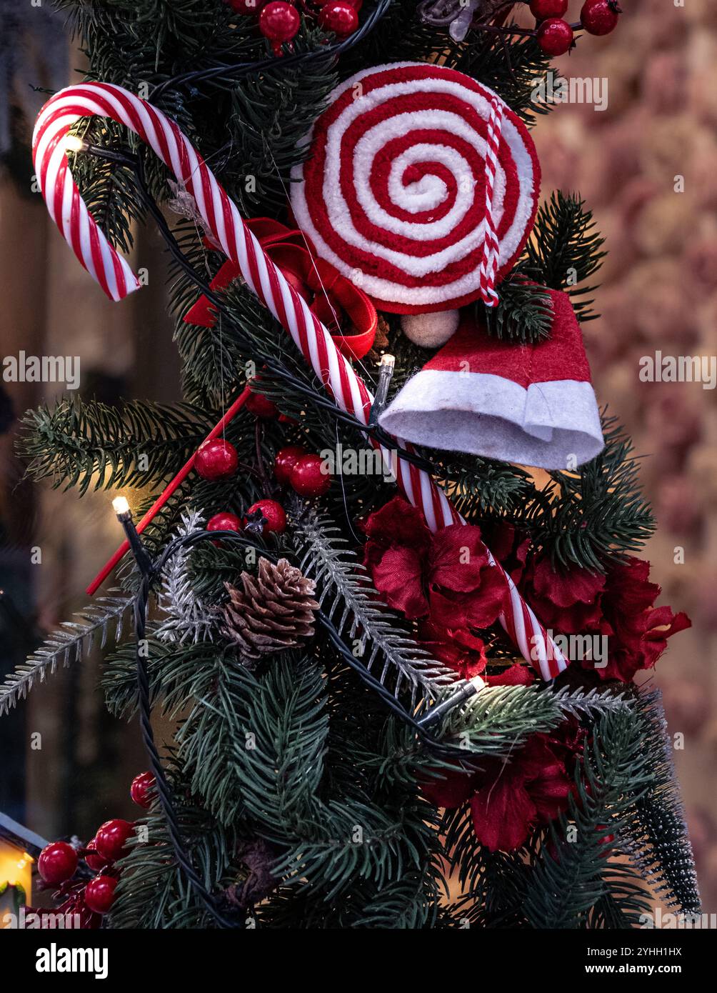 Christmas tree with red candy, lollipop, fir cone Stock Photo - Alamy