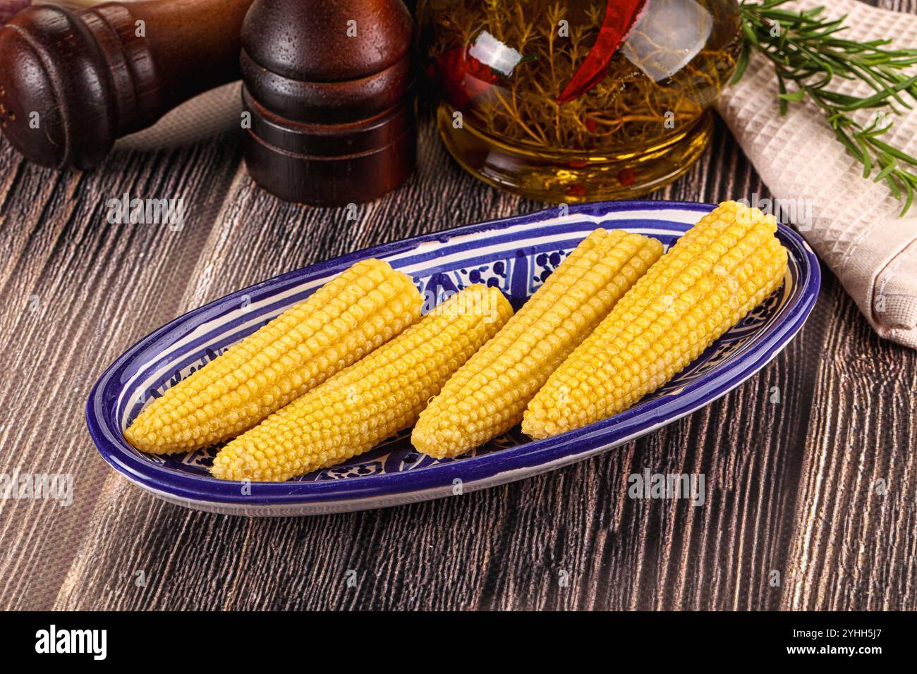 Canned baby mini corn cob in the plate Stock Photo - Alamy