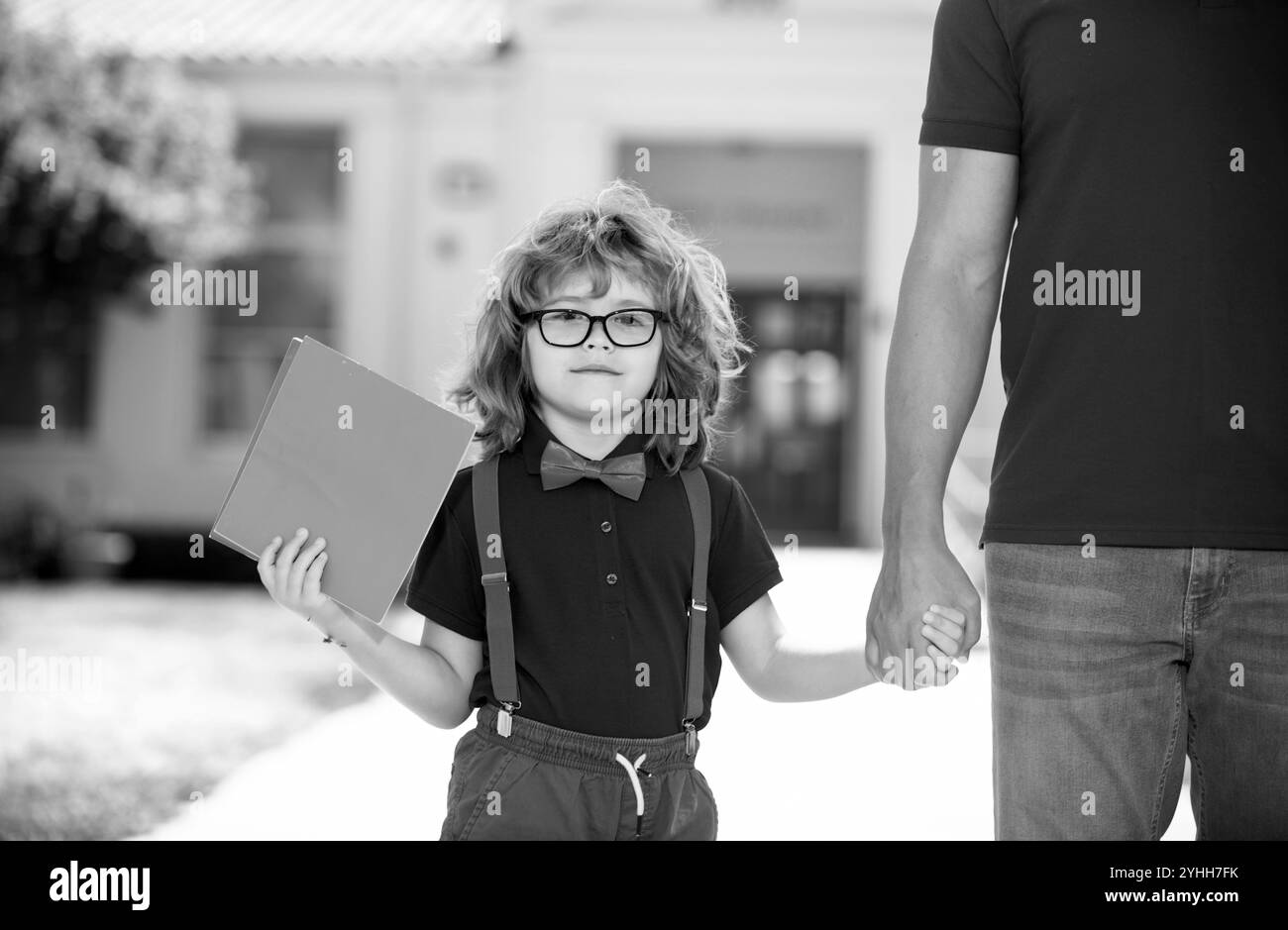 Father holding child children childhood Black and White Stock Photos ...