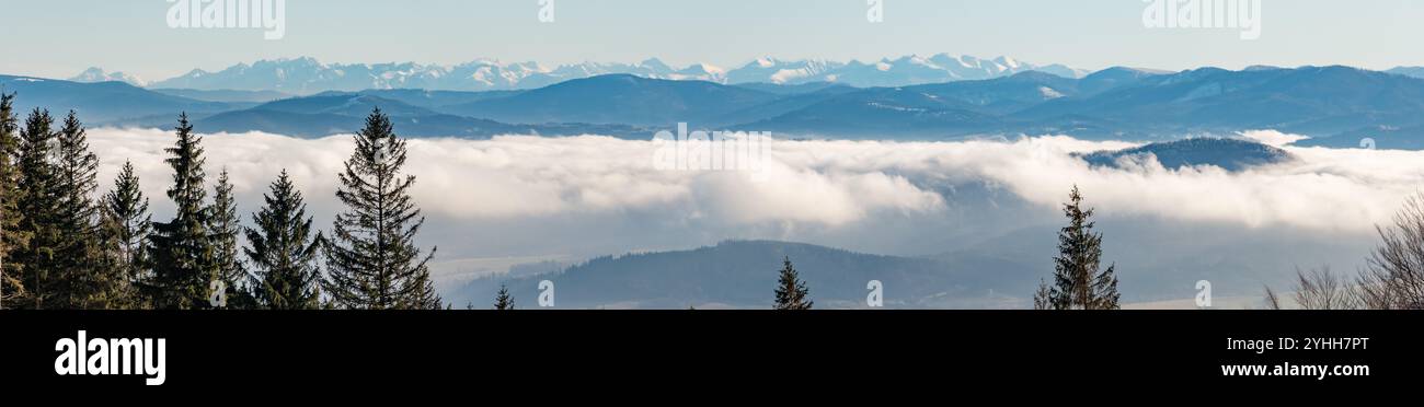 Panorama of mountain peaks above inversion with sunrise and morning ...
