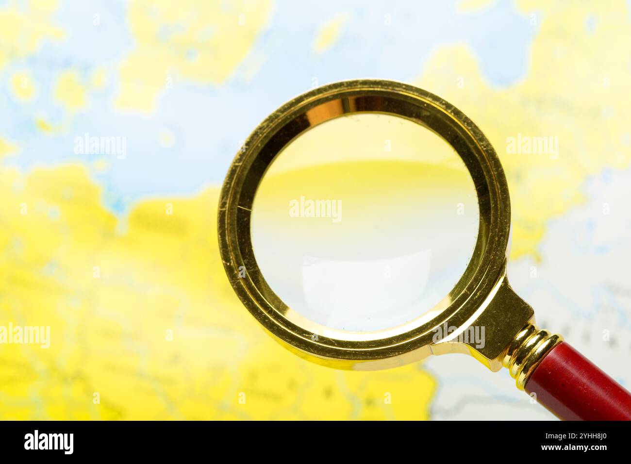 Magnifying glass and map Stock Photo - Alamy