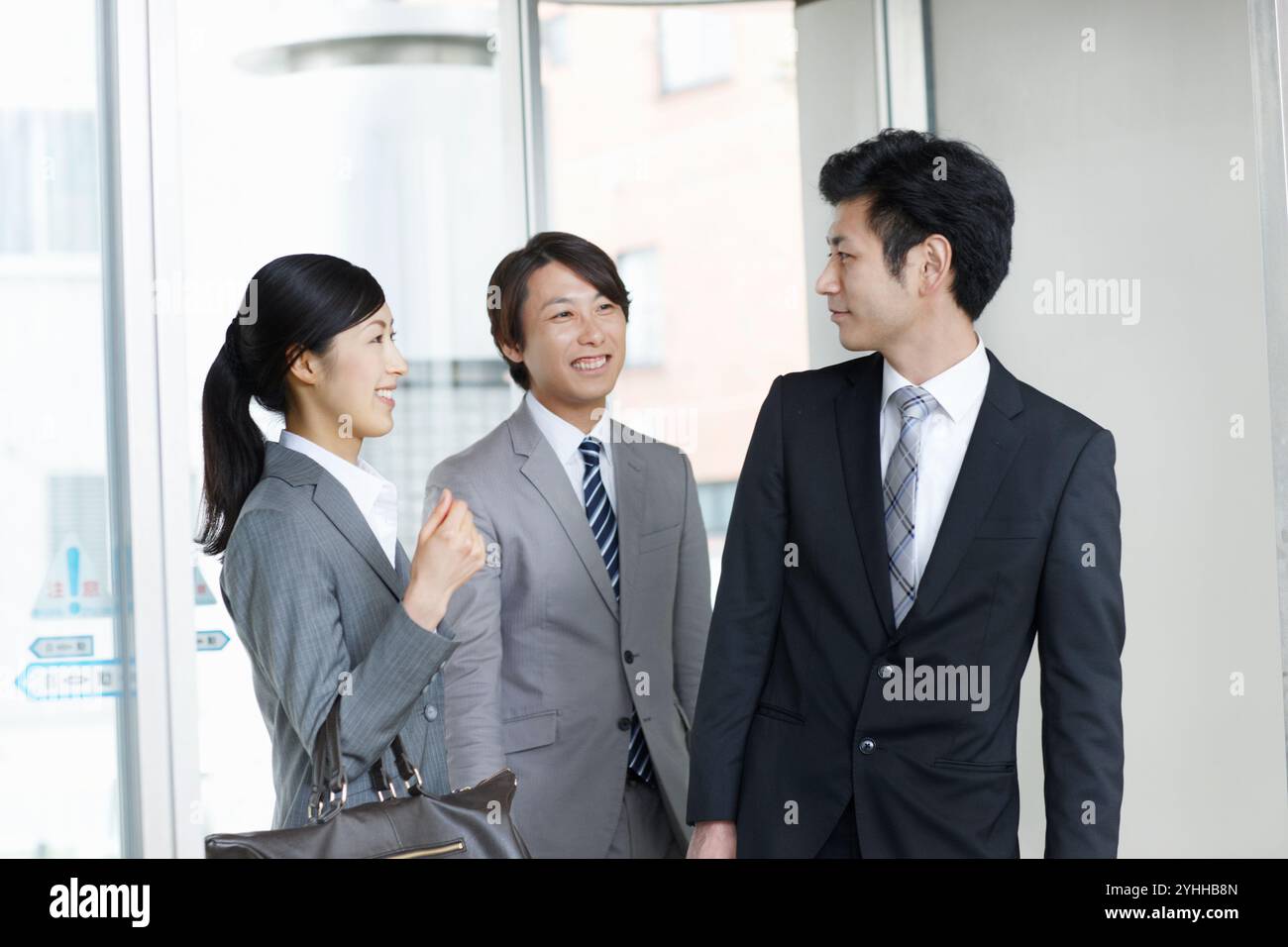 Business man and woman conversing Stock Photo - Alamy