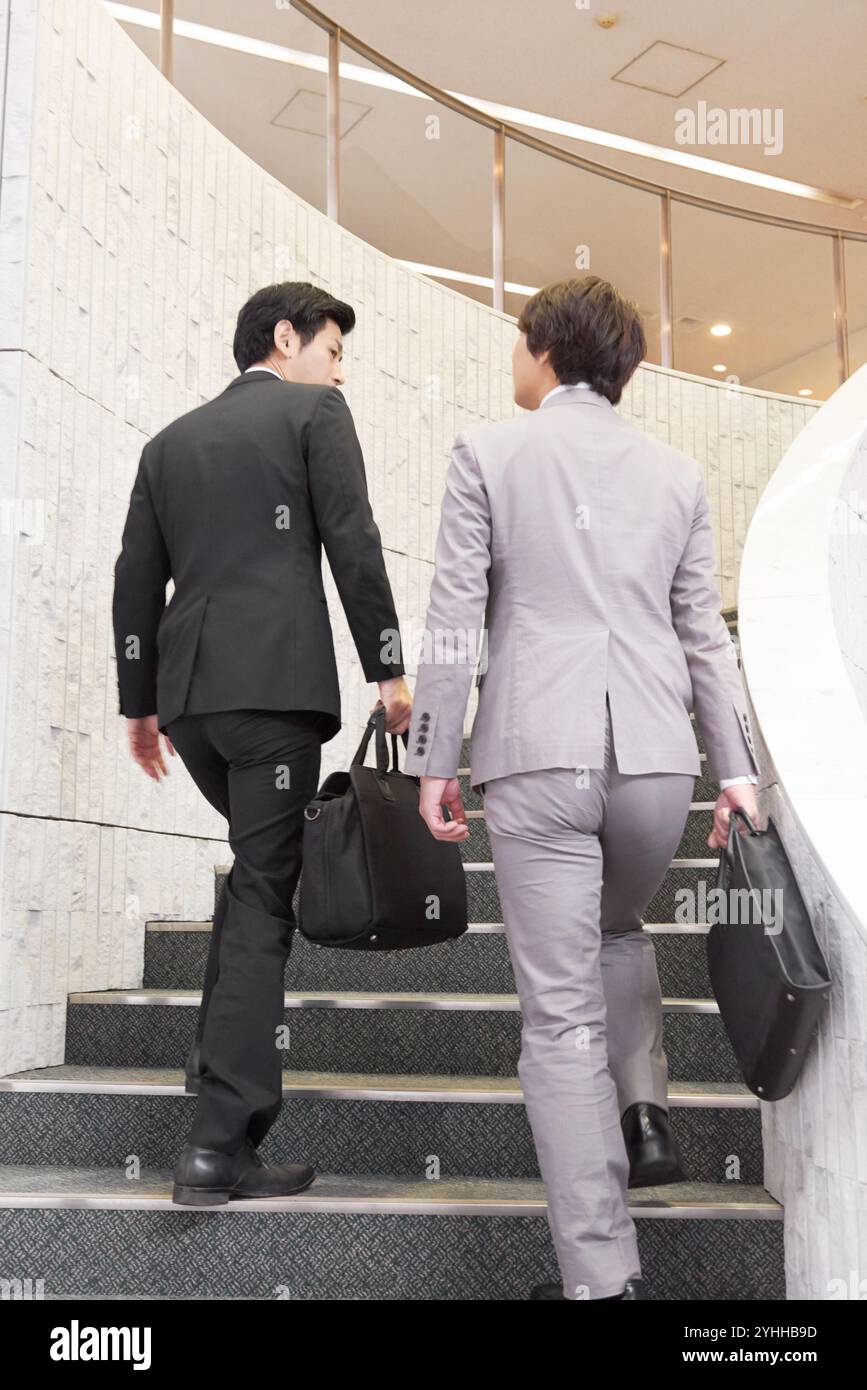 Businessman ascending the stairs Stock Photo - Alamy