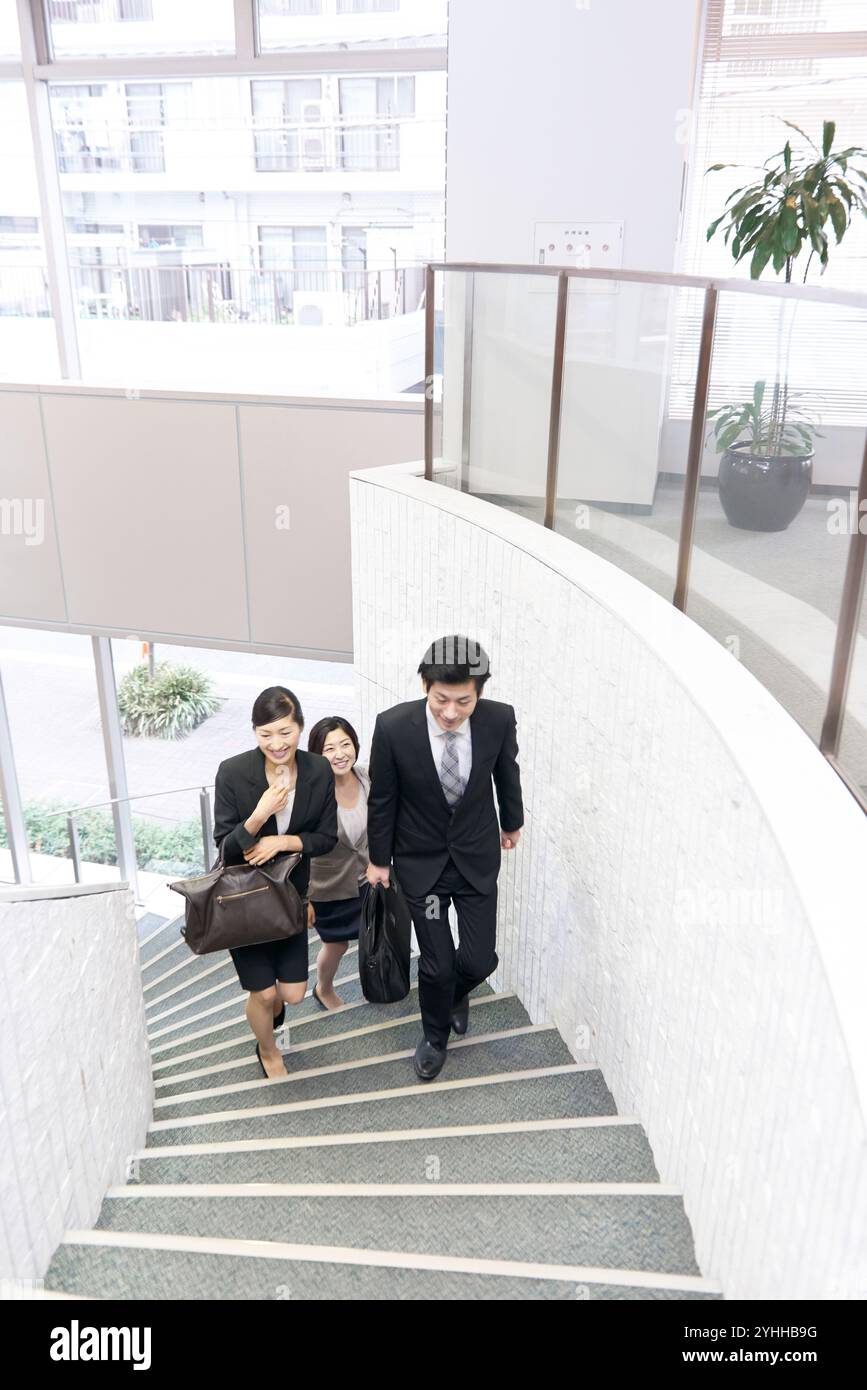 Business people ascending stairs hi-res stock photography and images ...