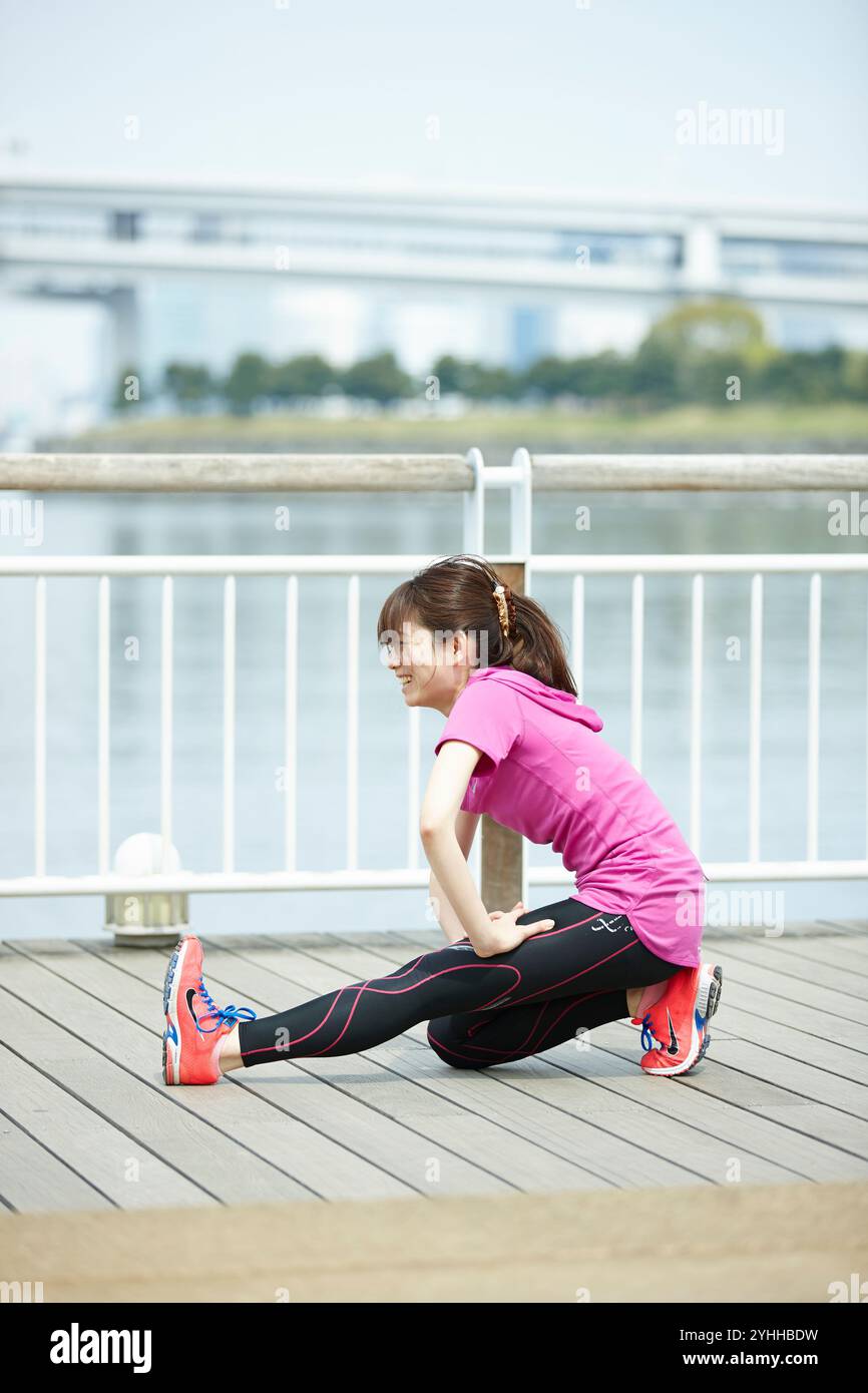 Woman doing warm-up exercises Stock Photo - Alamy