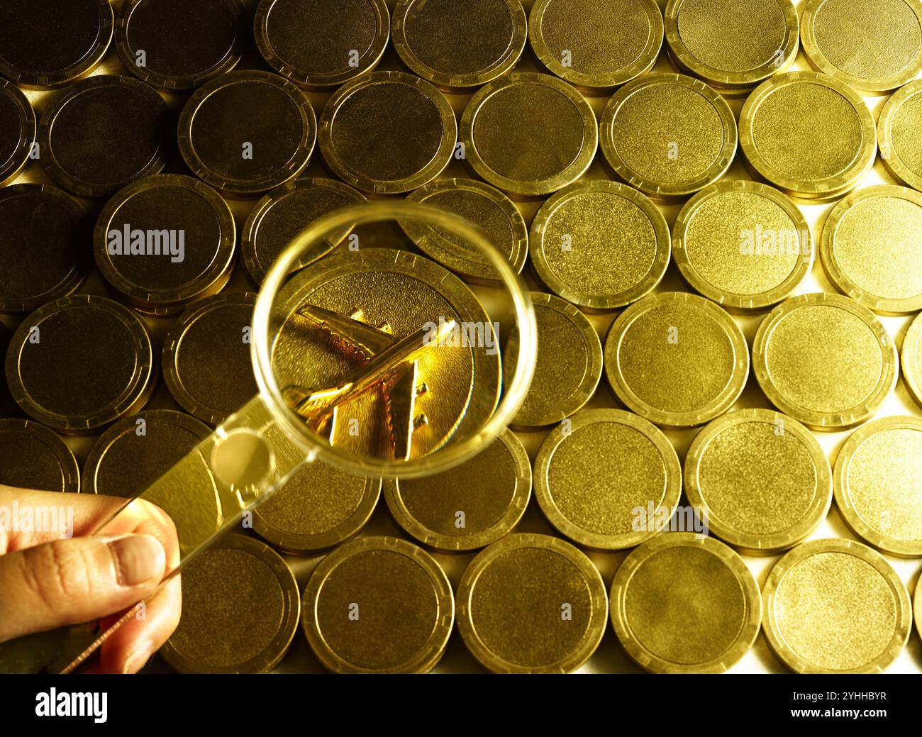 Gold coin, gold aeroplane and magnifying glass Stock Photo - Alamy