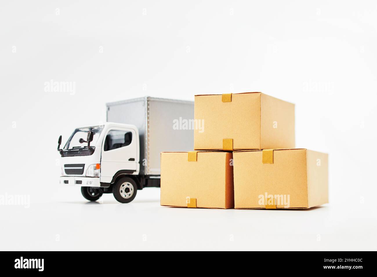 Logistics truck and cardboard box Stock Photo - Alamy