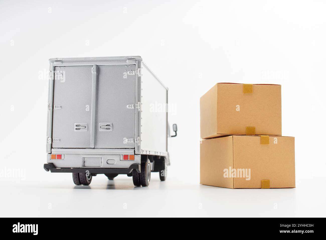 Logistics truck and cardboard box Stock Photo - Alamy