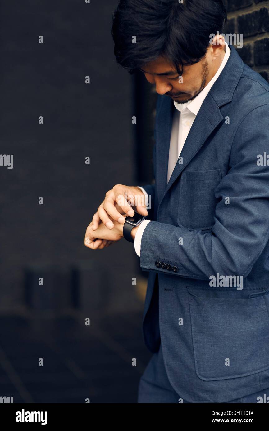 Smartwatch and businessman's hand with smartwatch Stock Photo - Alamy