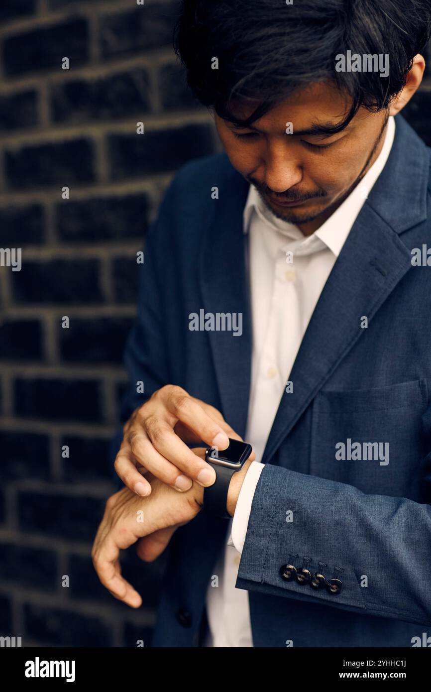Smartwatch and businessman's hand with smartwatch Stock Photo - Alamy