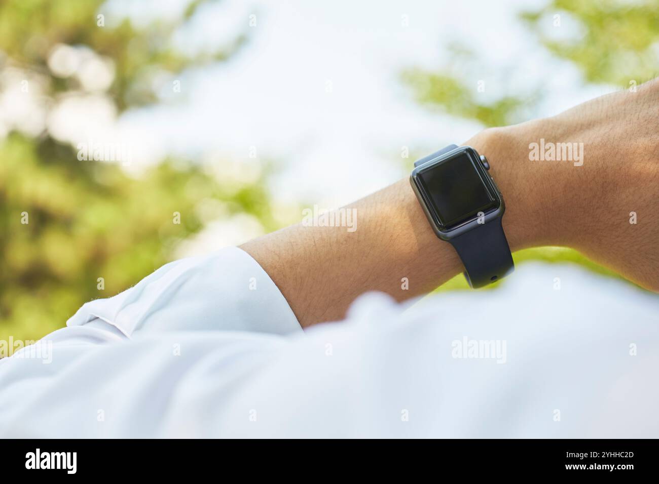 Man wearing a smartwatch Stock Photo - Alamy