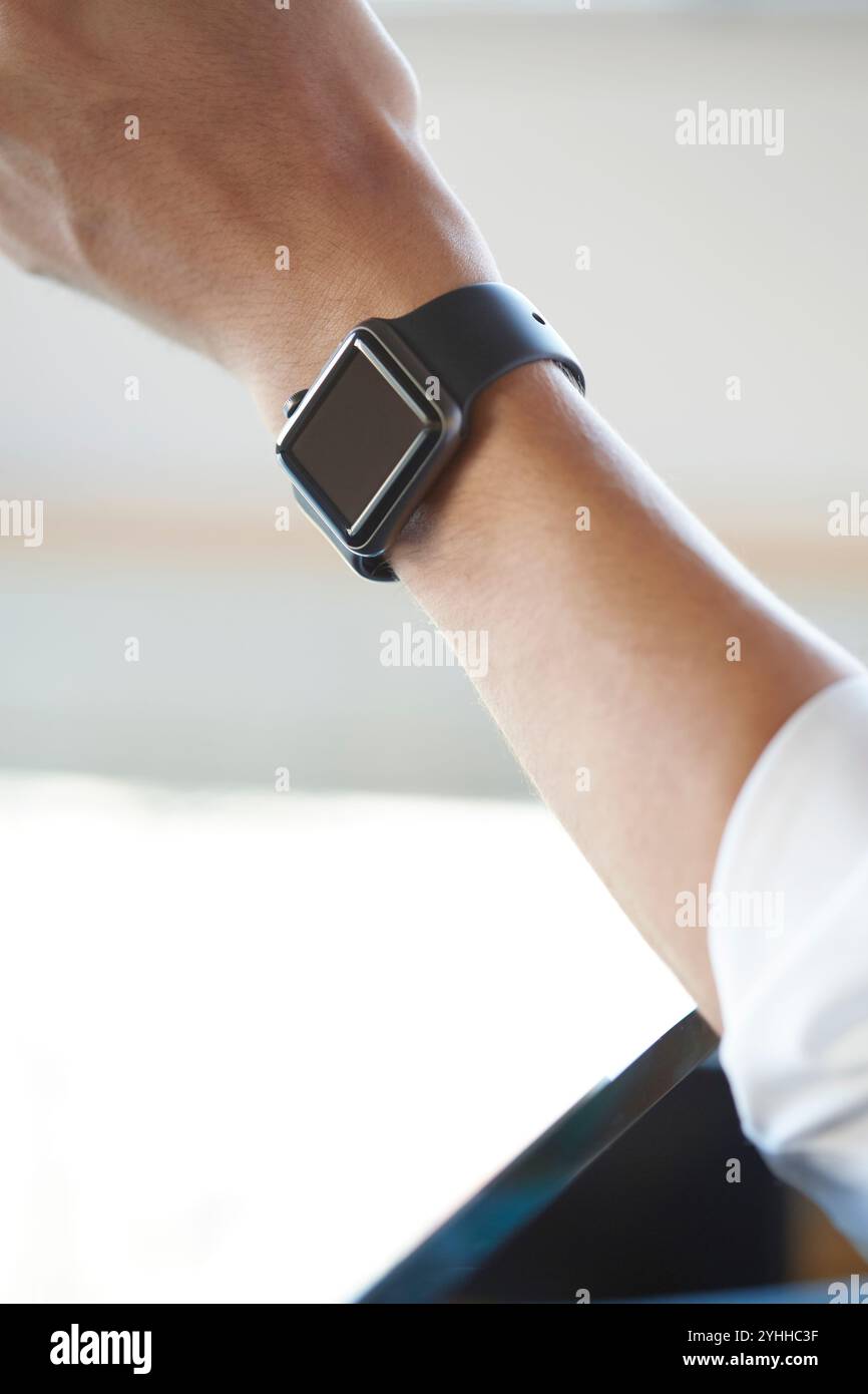 Smartwatches and men's arms Stock Photo - Alamy