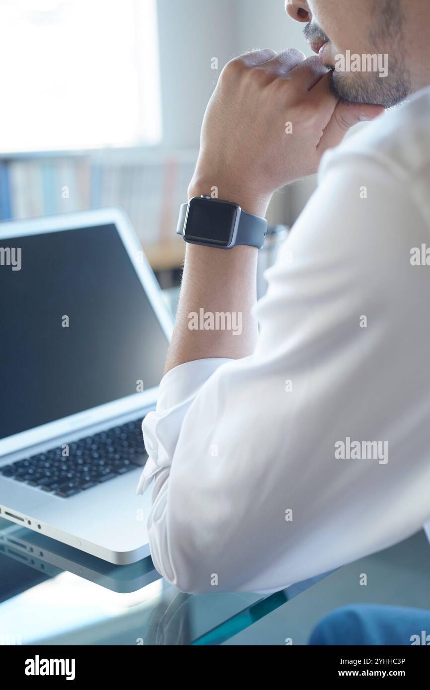 Smartwatch, computer and man's hand Stock Photo - Alamy