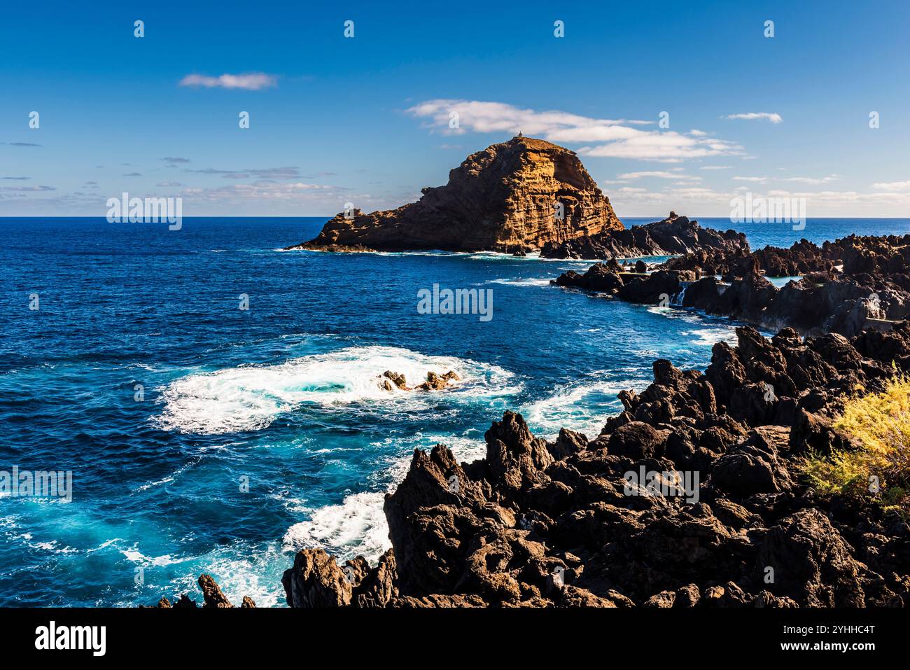 The island of Ilheu Mole and the lava rock formations at Porto Moniz ...