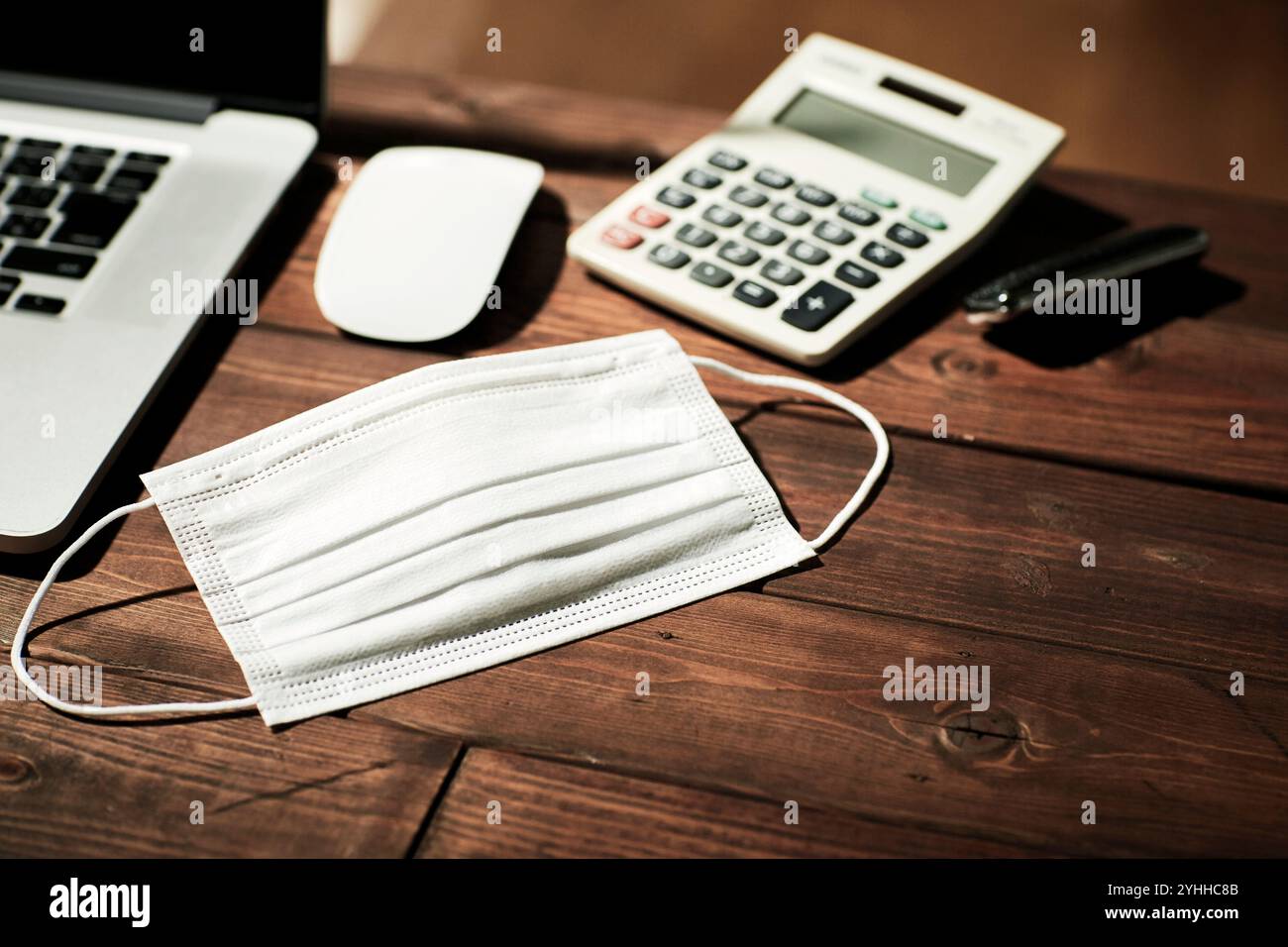 Mask, computer and calculator Stock Photo - Alamy