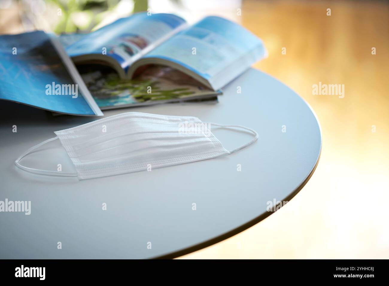 Mask and guidebook Stock Photo - Alamy